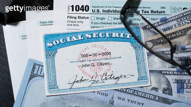 US tax documents with fake US currency and SSN card (2161413215) - 게티이미지뱅크