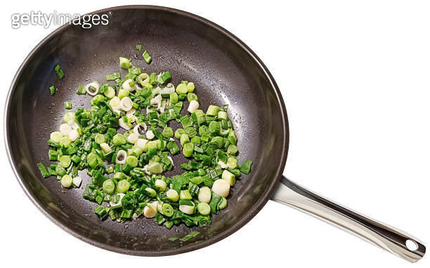 Browning Chopped Up Young Spring Scallions In Large Non Stick Ceramic ...