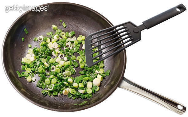 Browning Chopped Up Young Spring Scallions In Large Heavy Duty Non ...