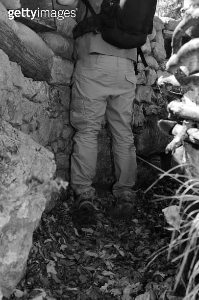 soldier and military uniform inside the narrow trench during the war in ...