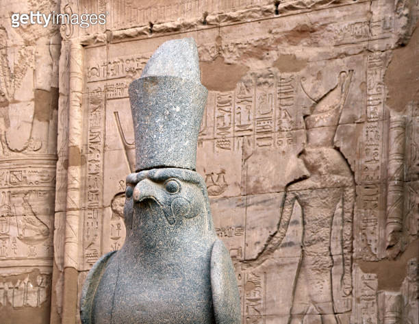 Granite statue of God Horus falcon at entrance Temple of Horus, Edfu ...