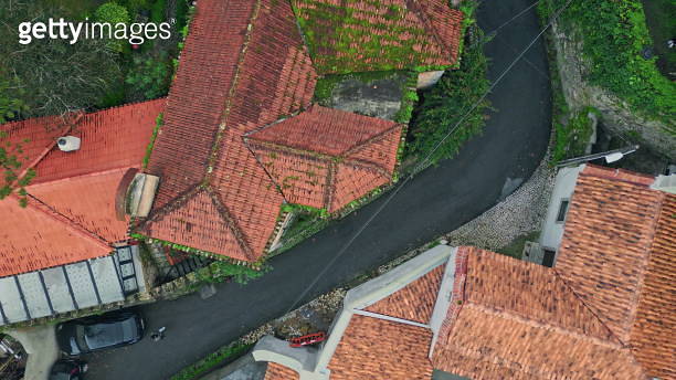 Red rooftops medieval village surrounded greenery top view. Cozy ...