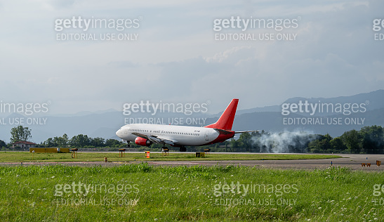 A white and red Boeing B737-400 B734 4 Airways is landing at the ...