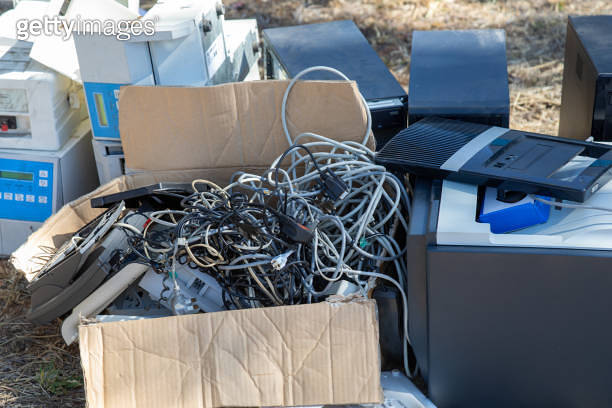 Waste electronic and electrical equipment (e-waste) , box with cables ...