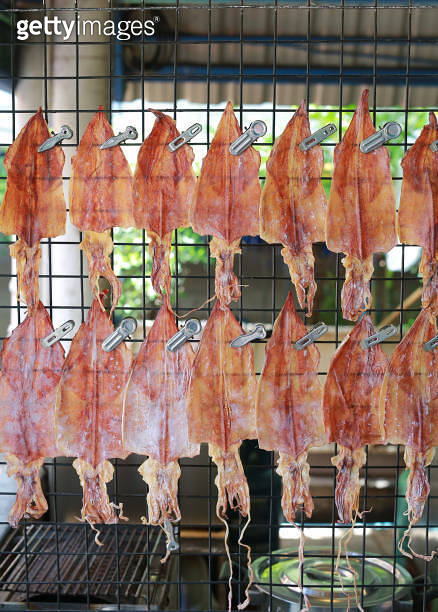 Dried squid clamp on grill, street food for sale in Thailand. 이미지 ...