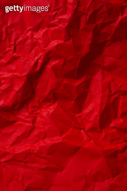 Wrinkled red paper texture,Rectangular crumpled sheet of red paper on a ...