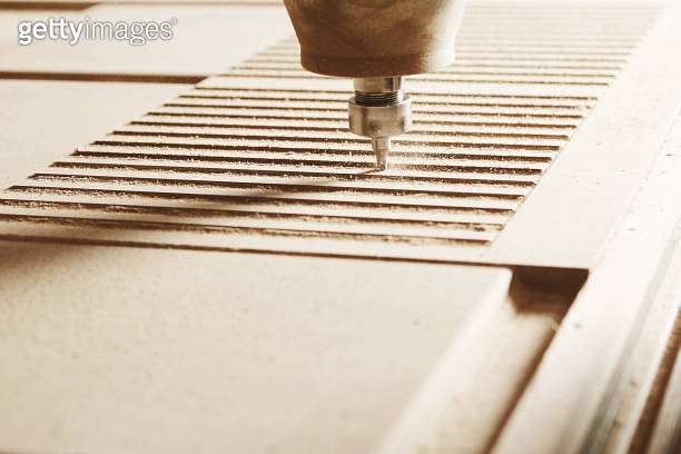 Numerically controlled woodworking machine cuts complex lines on the ...