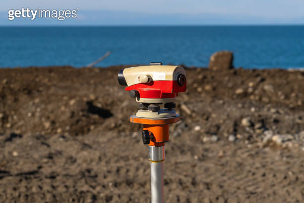 Close-up image of optical level or surveying instrument used to measure ...