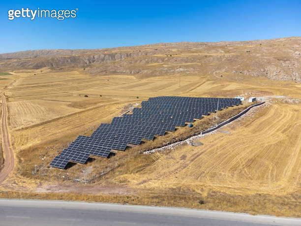 View from the drone on the rows of solar panels. Photovoltaic panels ...