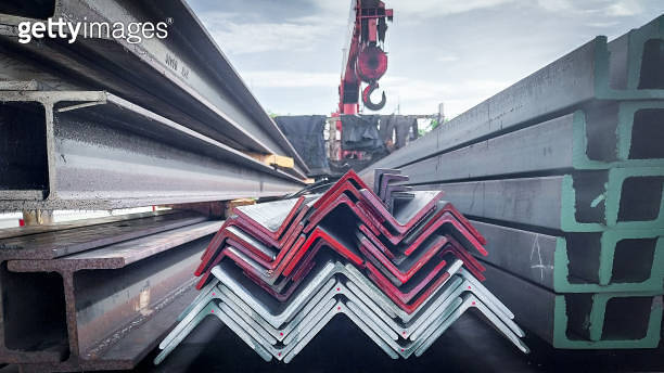 Angle iron cross section in stockyard.Steel angles. Stuck og L-beams on ...