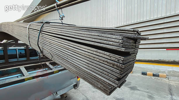 Flat steel bars stacked in abstract form. Stack of steel flat bar of ...