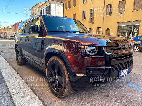 Land Rover Defender 130 SE Sedona Red suv 4x4 vehicle in a parking ...