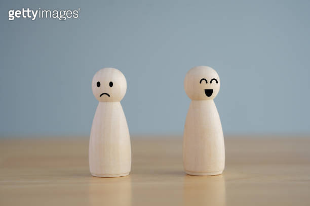 Opposite emotions smile and sad. Two human figure with happy face and ...