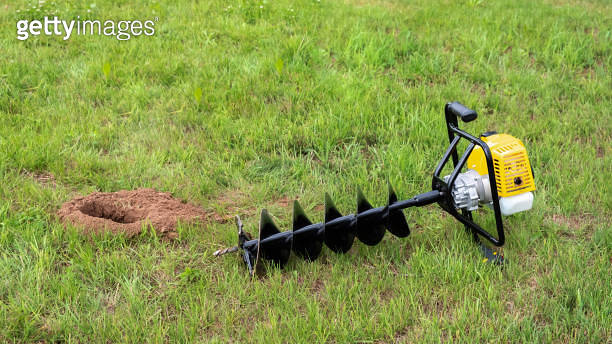The drilled ground. The land hole. Borer for the fence installation ...