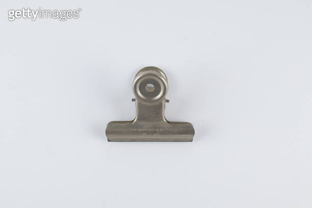 Silver paper clip on white background. Metal paper clip, holder. Steel ...