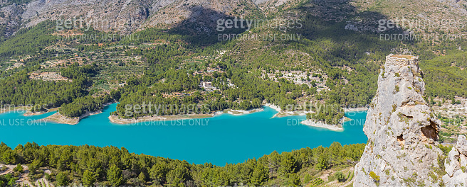 Panoramic view over the ruins of a round castle tower above the blue ...