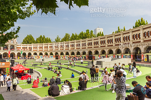 People sitting at the inner square of the Minyuan Stadium of Tianjin ...