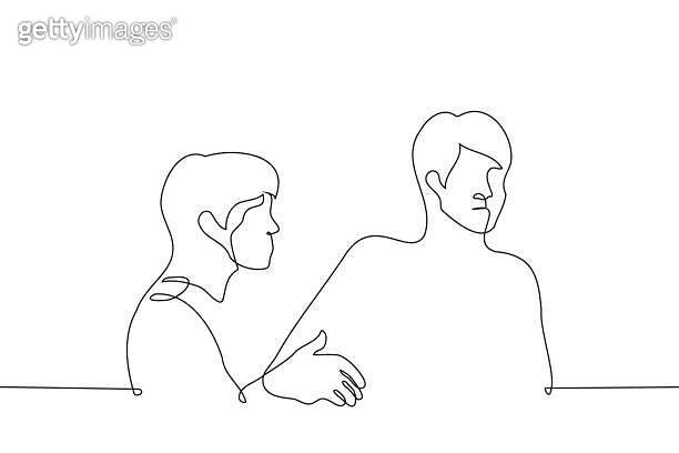 man grabs a friend by the hand and pulls him to him but the other doesn ...