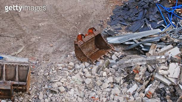 Heavy Machinery Equipment and Pieces of Cinder Block Concrete Rubble ...