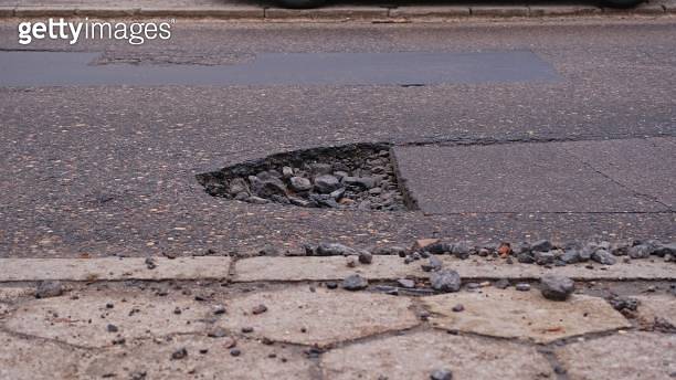 Deep Pothole in Asphalt Road Surface Caused by Erosion during Winter ...