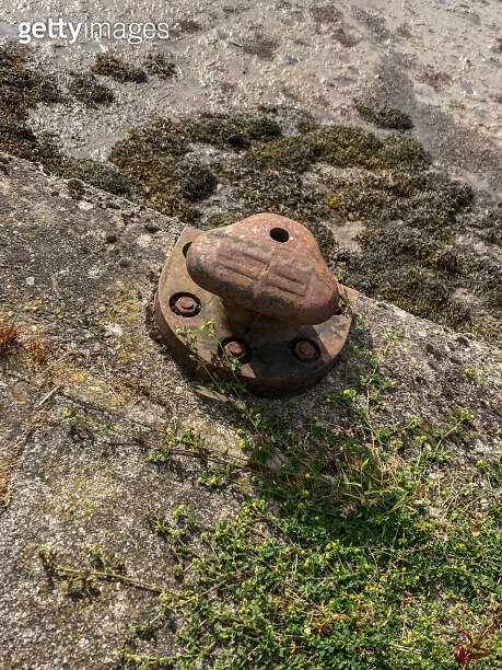 Old rusty anchor point for boats to anchor to - providing stability for ...