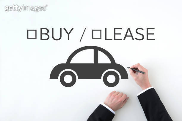 Business man’s hand drawing car pictogram and BUY / LEASE word ...