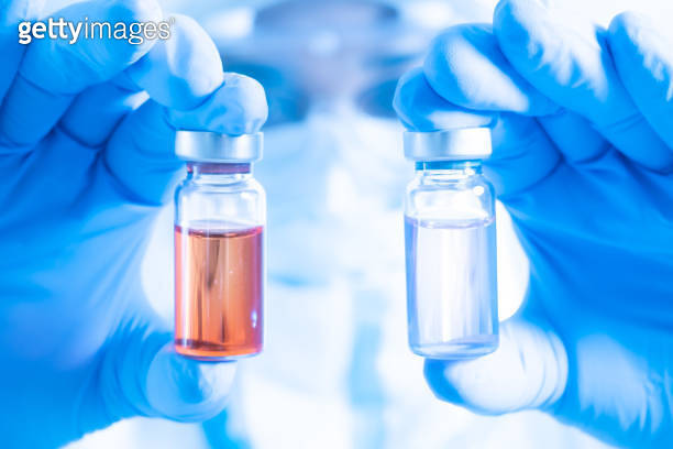 Medical Nurse in safety gloves and protective mask is showing different ...