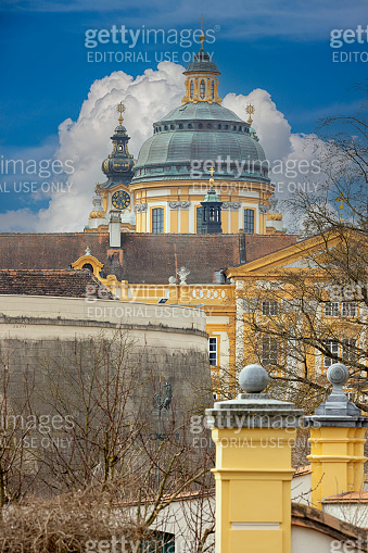 View of Melk Abbey with Collegiate Church towers on background of blue ...