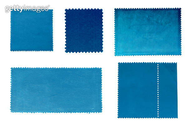 Set of blue blank postage stamps isolated on white background. Texture ...