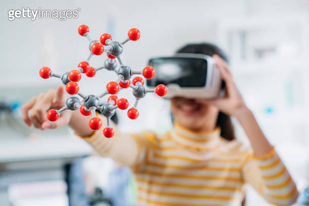 Child Explores Molecular Models with VR Glasses. Girl Wearing Reality Headset Interacts with 3D ...