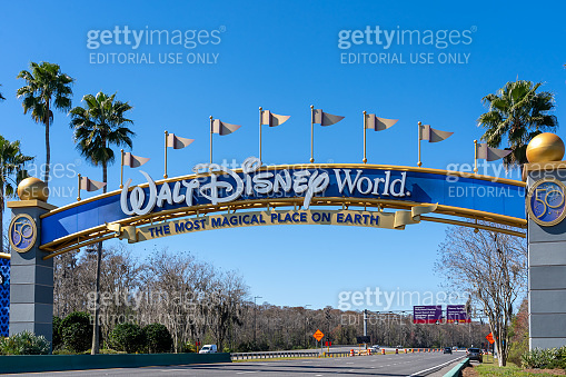 A Walt Disney World arch gate on the street in Orlando, Florida, USA ...