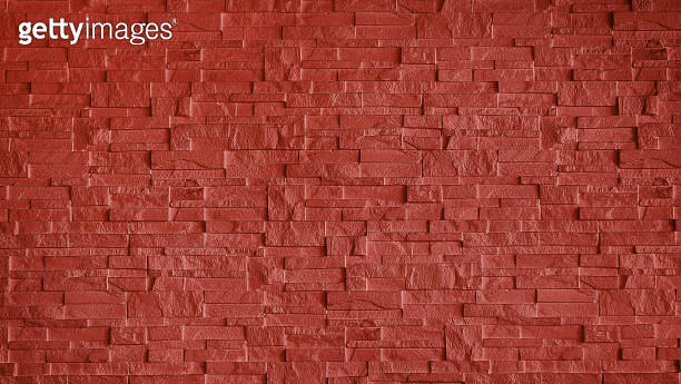 abstract stone cladding wall made of regular bright red bricks ...