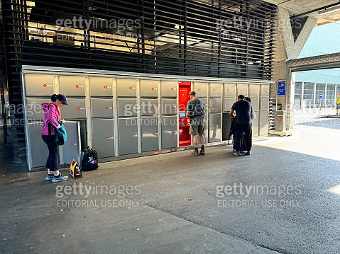 Customers use luggage storage lockers at the Zurich HB main train ...