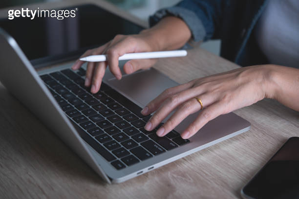 Young buisness woman online working, females hands typing on laptop ...