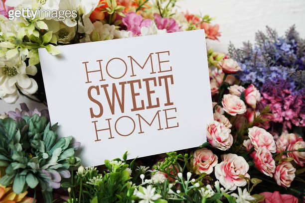 Home Sweet Home text message on paper card with beautiful flowers ...