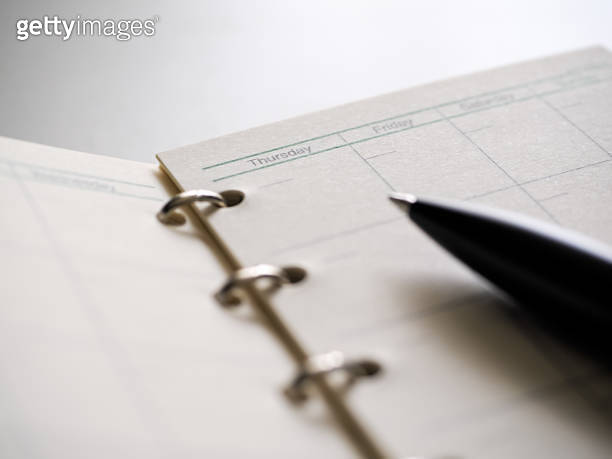 Ring bound planner and pen on white background 이미지 (2164185463) - 게티이미지뱅크