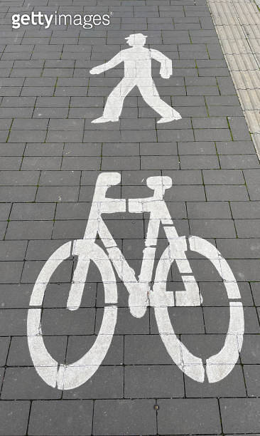 Cycle path and pedestrian signs on paving stones. 이미지 (2048813178) - 게티 ...