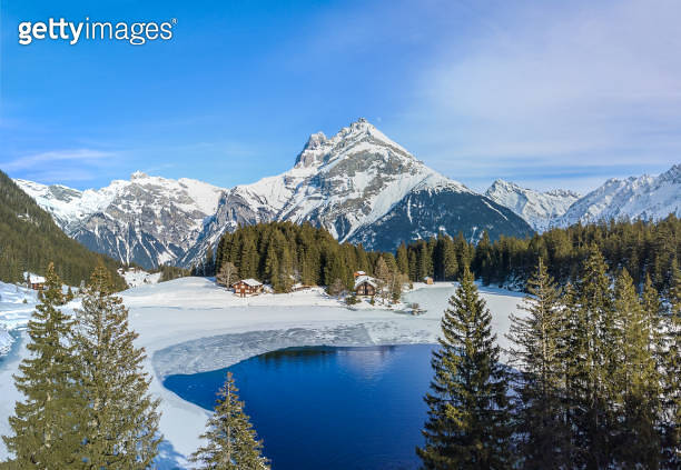 Aerial image of the winter landscape of the frozen Arni Lake with the ...