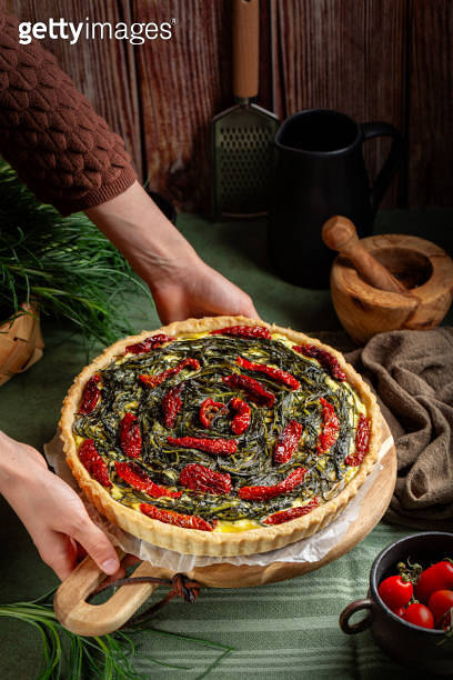 Serving italian rustic savory pie made with pie crust, salsola soda or ...