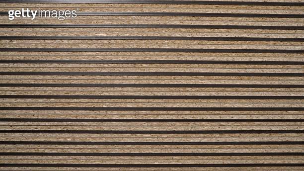 A stack of MDF panels close-up at a furniture production facility ...