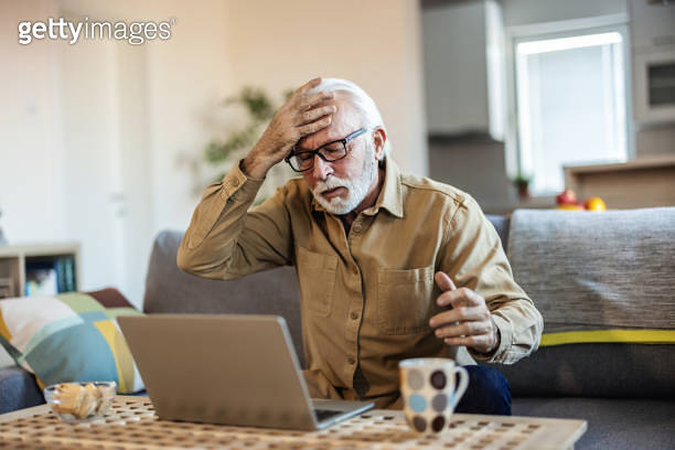 Man feeling frustrated while using his laptop. .Angry stressed business ...