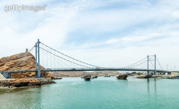 Traditional omani wooden dhow boats under Al Ayjah bridge, Sur ...