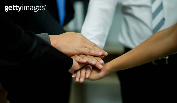 Hands together, teamwork, cooperation and unity in work and success in ...