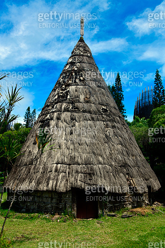 Kanak great house - conical building with thatched roof and finial ...