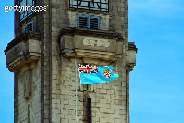 Parliament of Fiji clock tower and Fijian flag, Fiji Government ...