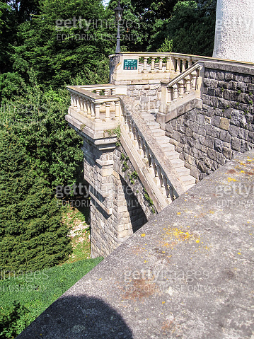 Decorative stone balcony with stone stairs leading to the castle garden ...