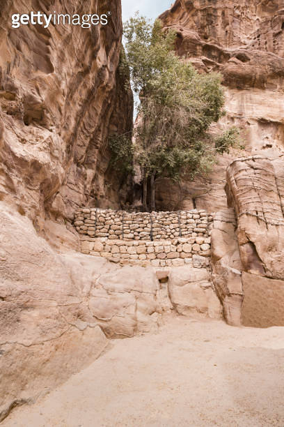 A man made dam in gorge Al Siq in Nabatean kingdom of Petra in Wadi ...