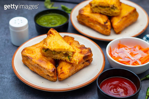 Selective Focus of Bread pakora is a popular Indian street food made ...