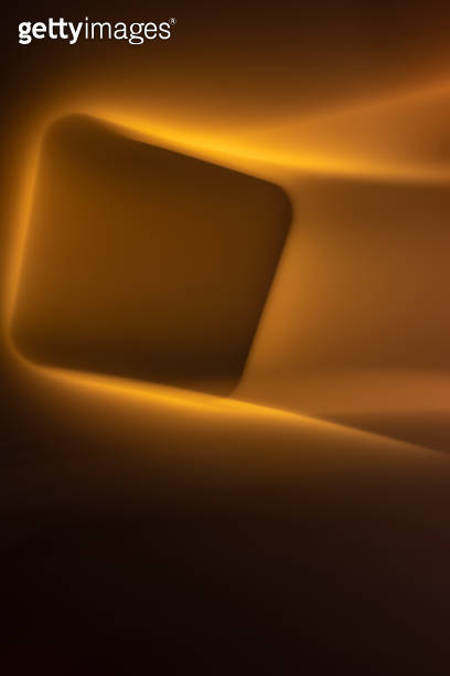 Abstract glowing square with smooth lines in yellow-orange colors on a ...