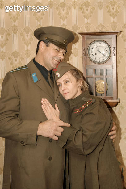 A paired portrait of a military family separated by war. Farewell hugs ...